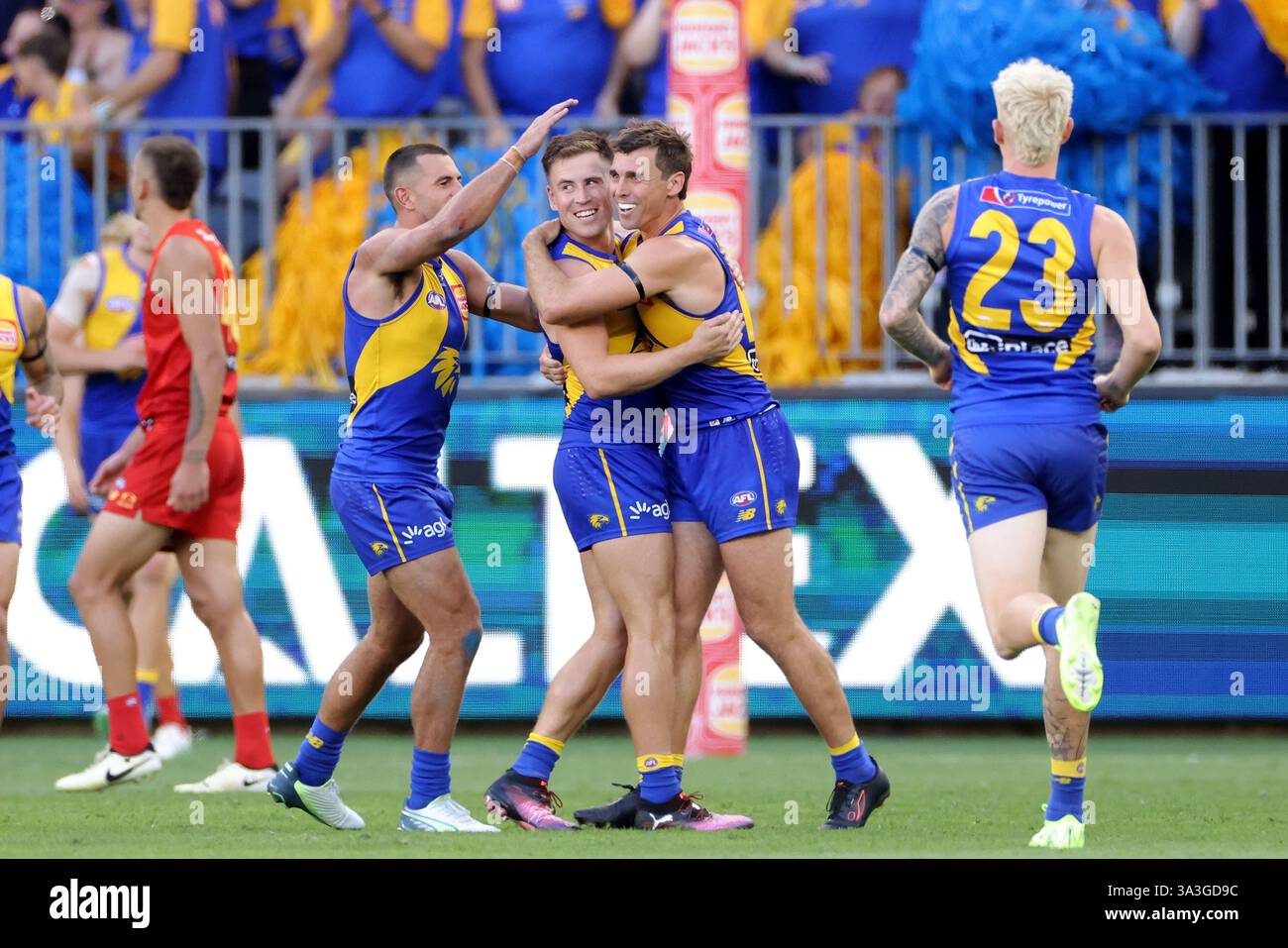 Matthew Owies of the Eagles is congratulated by teammates after kicking ...