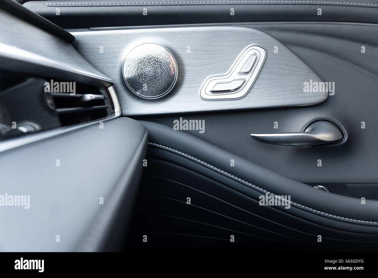 Door handle with Power seat control buttons of a luxury passenger car ...