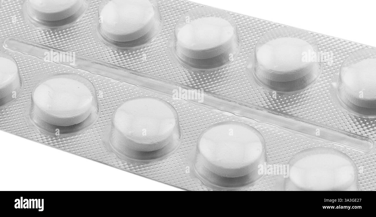 Macro shot pile of tablets pill in silver blister packaging isolated on ...