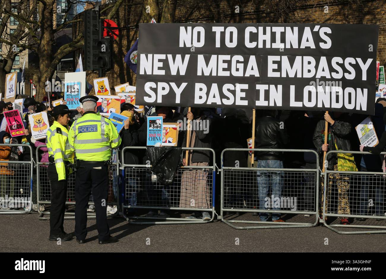 Protesters hold a huge banner saying “No To China’s New Mega Embassy ...