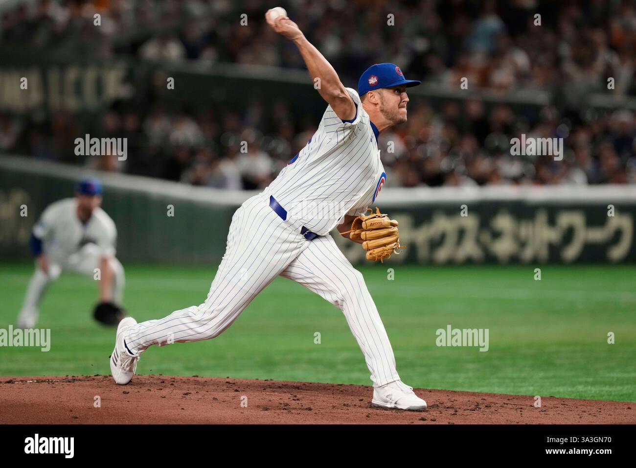 Chicago Cubs pitcher Jameson Taillon throws to the Yomiuri Giants in ...