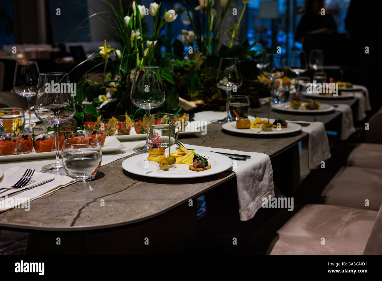 Elegant table decor for luxury dining with floral centerpieces Stock ...