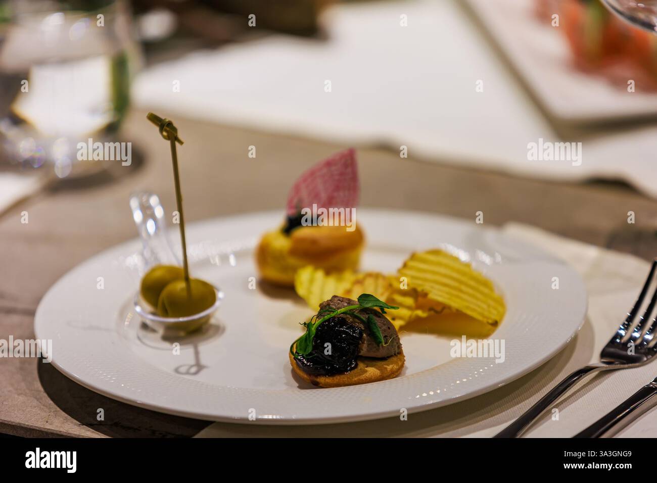 Elegant gourmet appetizers served on white porcelain Stock Photo - Alamy