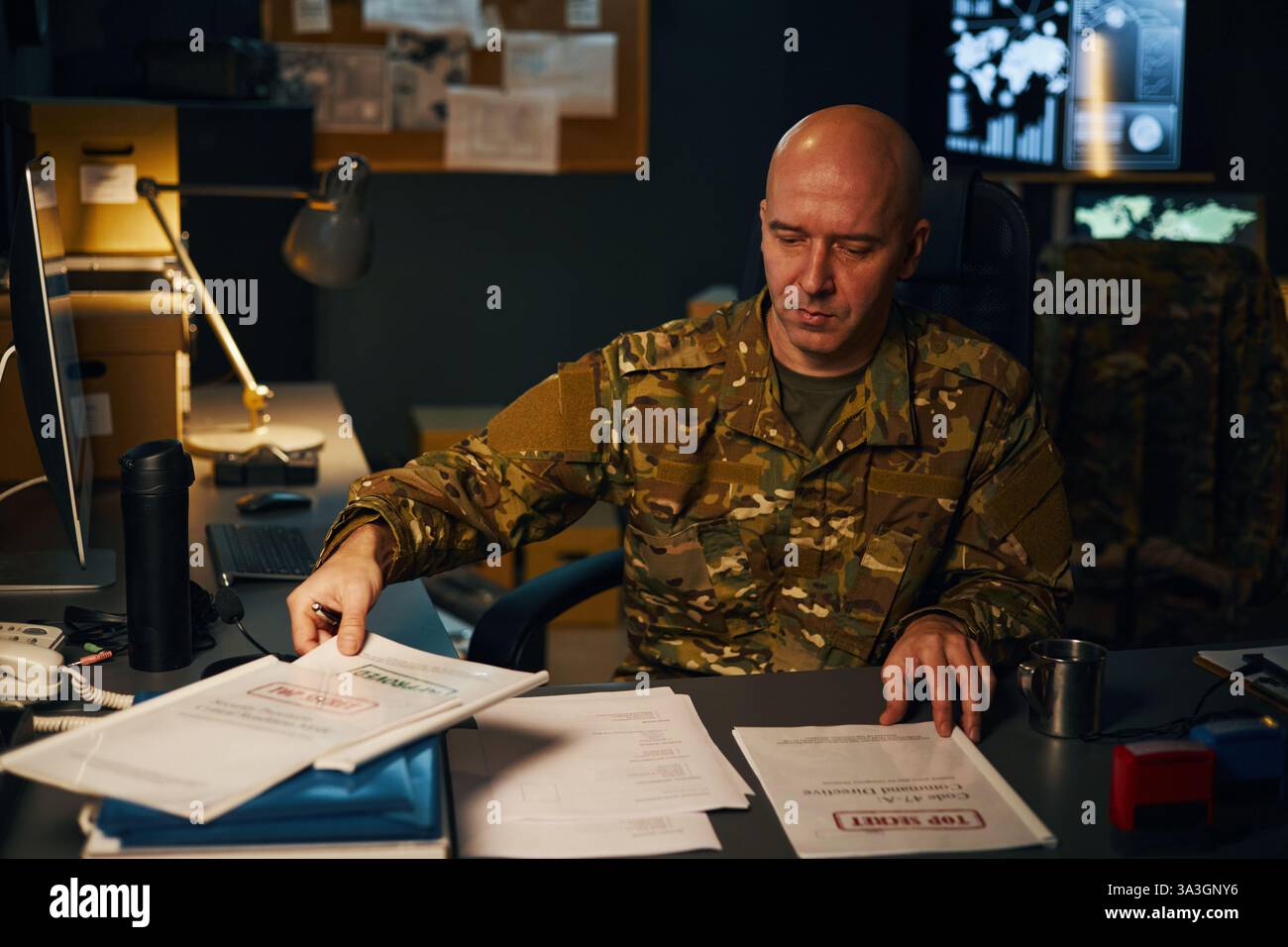 Working At Desk in Military Office Reviewing Documents Stock Photo - Alamy