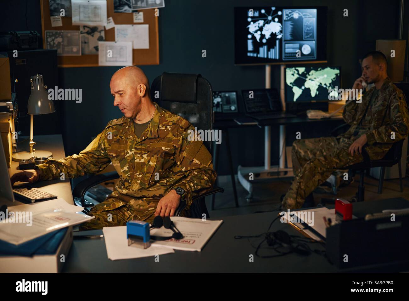 Analyzing Data in Military Command Center Setting Stock Photo - Alamy