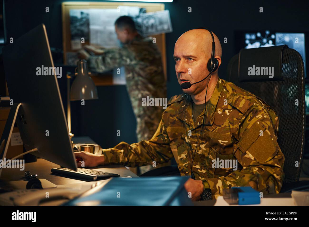 Working in Military Office with Headset On Stock Photo - Alamy