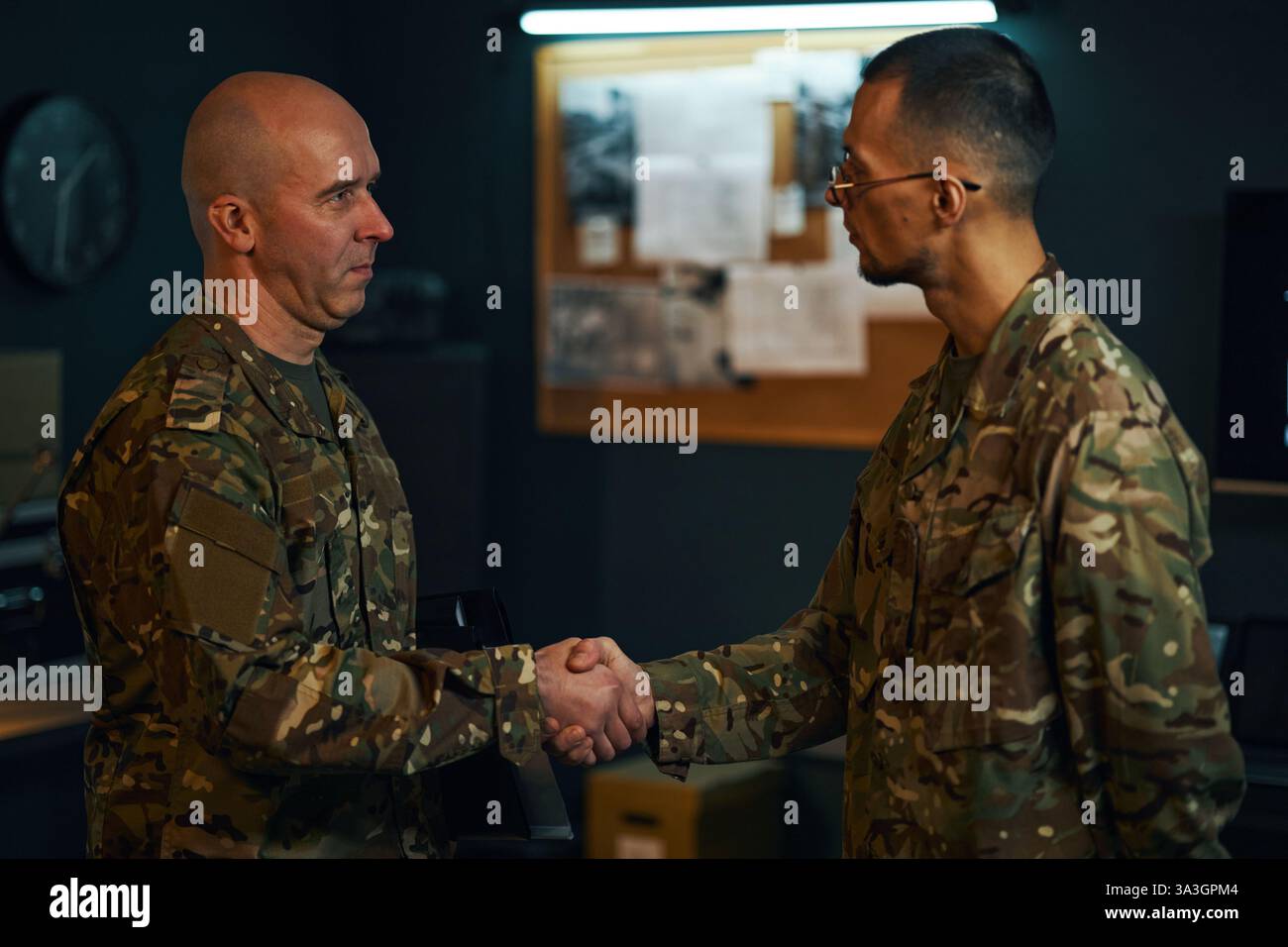 Military Officers Shaking Hands in Office Setting Stock Photo - Alamy