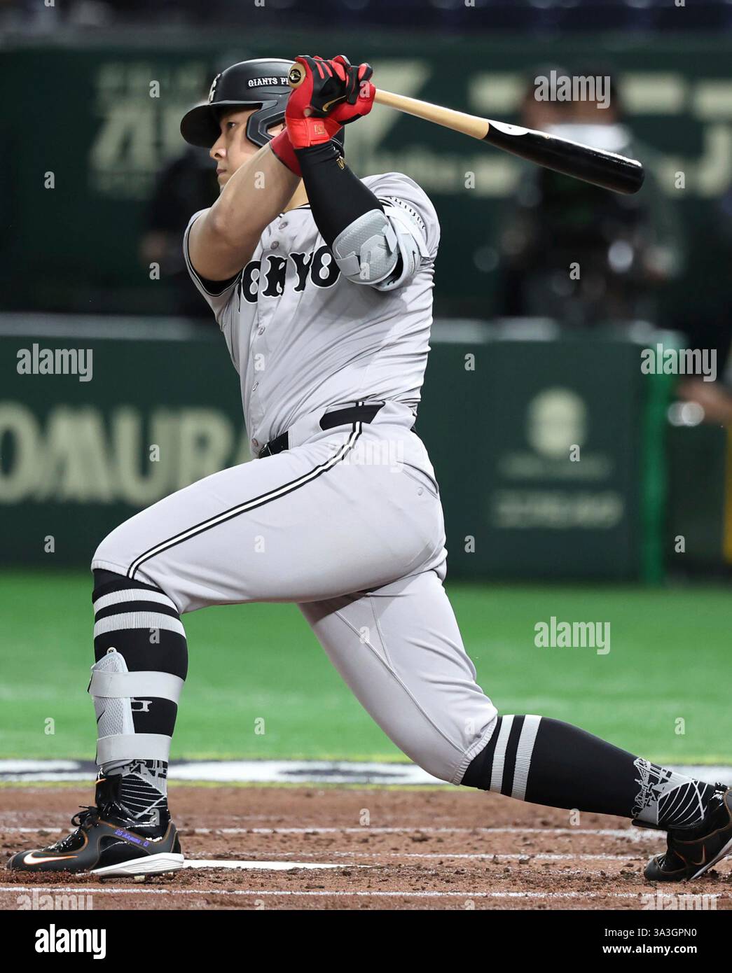 Yomiuri Giants' infielder Kazuma Okamoto hits a single in the second ...
