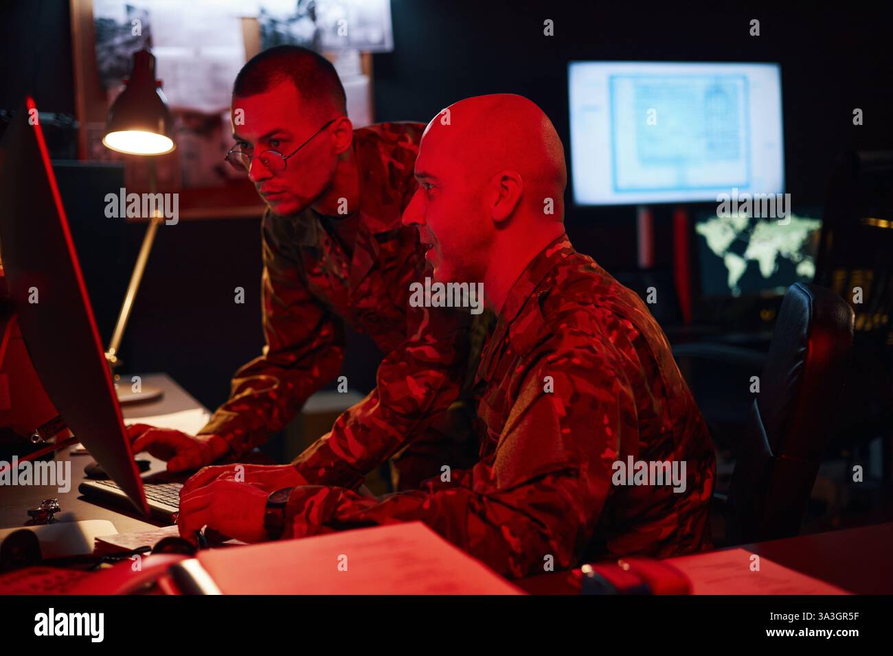 Military Personnel Analyzing Data in Command Center Stock Photo - Alamy