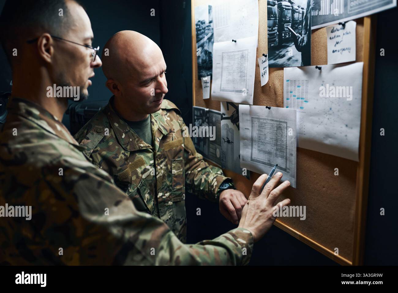 Reviewing Military Plans on Bulletin Board During Briefing Stock Photo ...