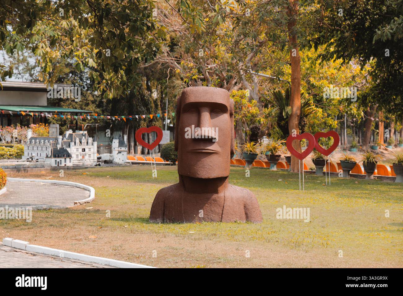 Experience the Moai Statue in a scenic park, drawing visitors with its ...