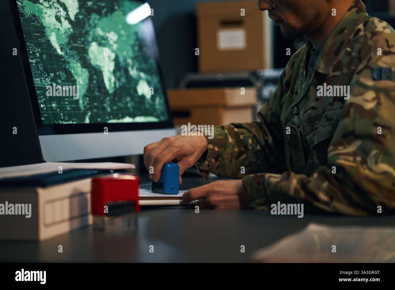 Working on a Desktop in Military Attire Stock Photo - Alamy