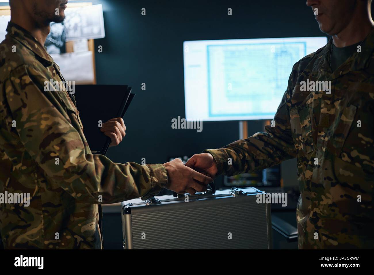 Handshake Between Military Personnel in Office Setting Stock Photo - Alamy