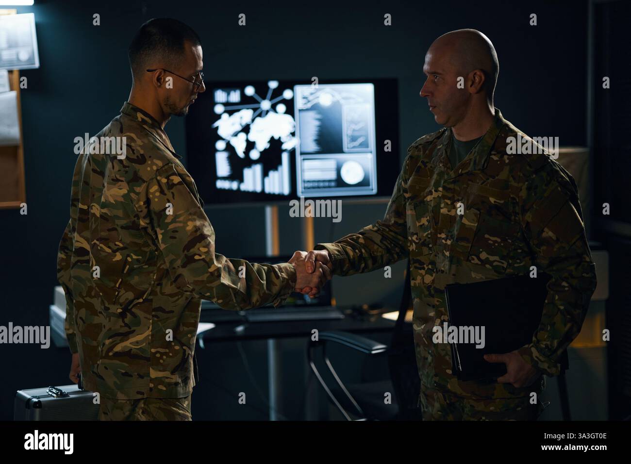 Meeting Among Military Personnel in Dark Room Stock Photo - Alamy