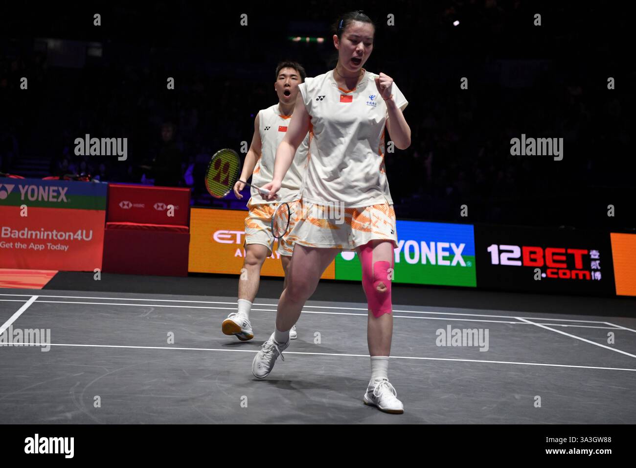 China's Chen Fang Hui, right, and Guo Xin Wa celebrate scoring a point ...