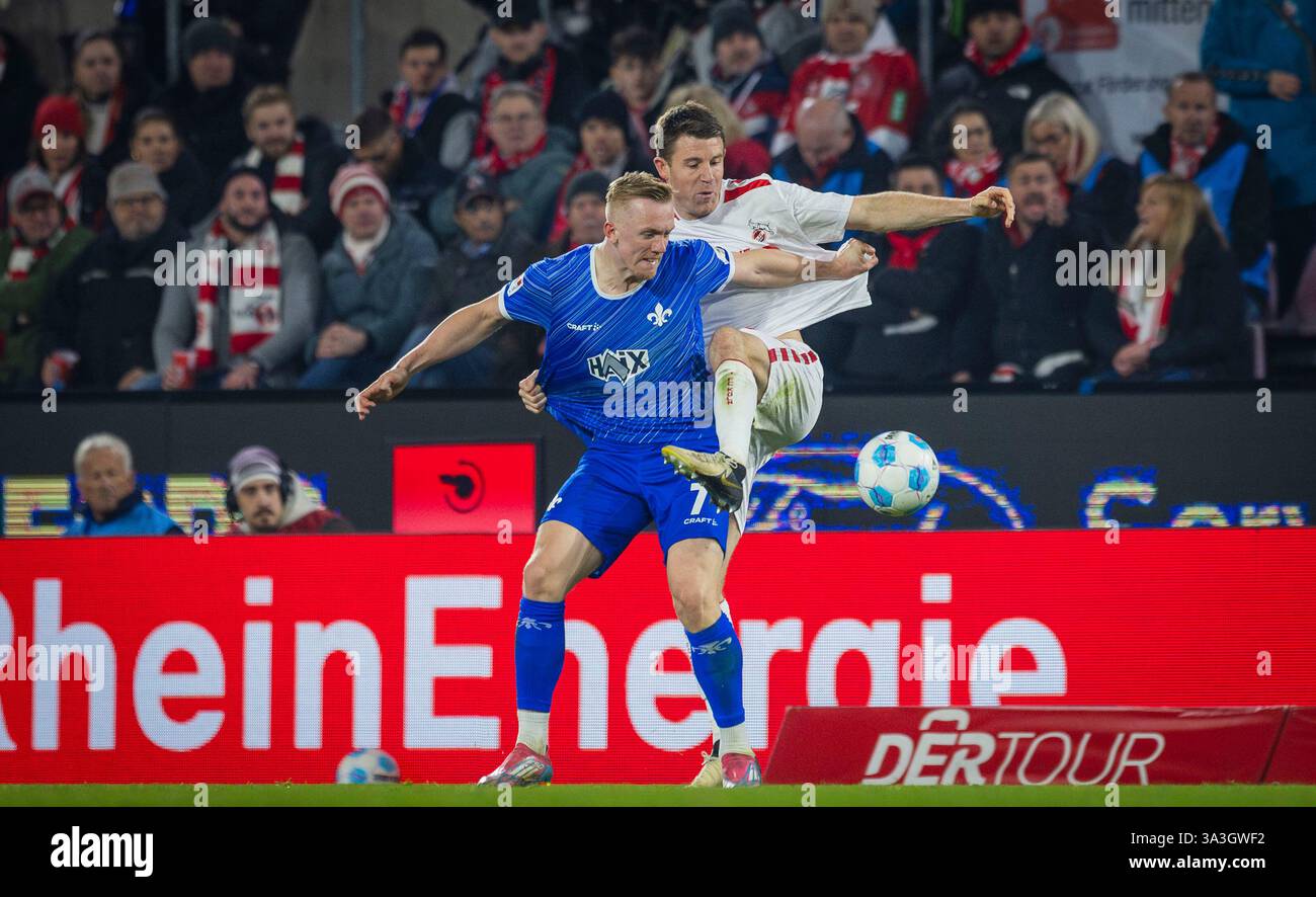 Cologne, Germany. 15th Mar 2025. Isac Lidberg (D98) Dominique Heintz ...