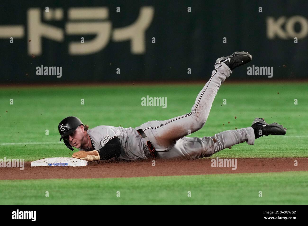 Yomiuri Giants' Trey Cabbage, steals second in the fourth inning of an ...