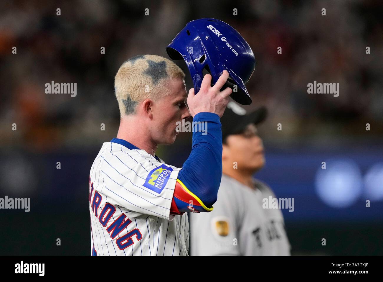 Chicago Cubs' Pete Crow-Armstrong adjust his hemet after stealing third ...
