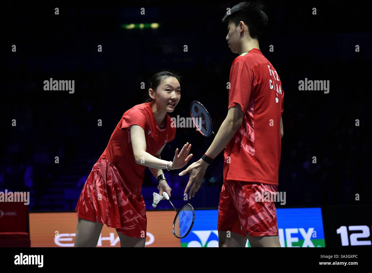 China's Wei Ya Xin, left, and Feng Yan Zhe celebrate scoring a point ...