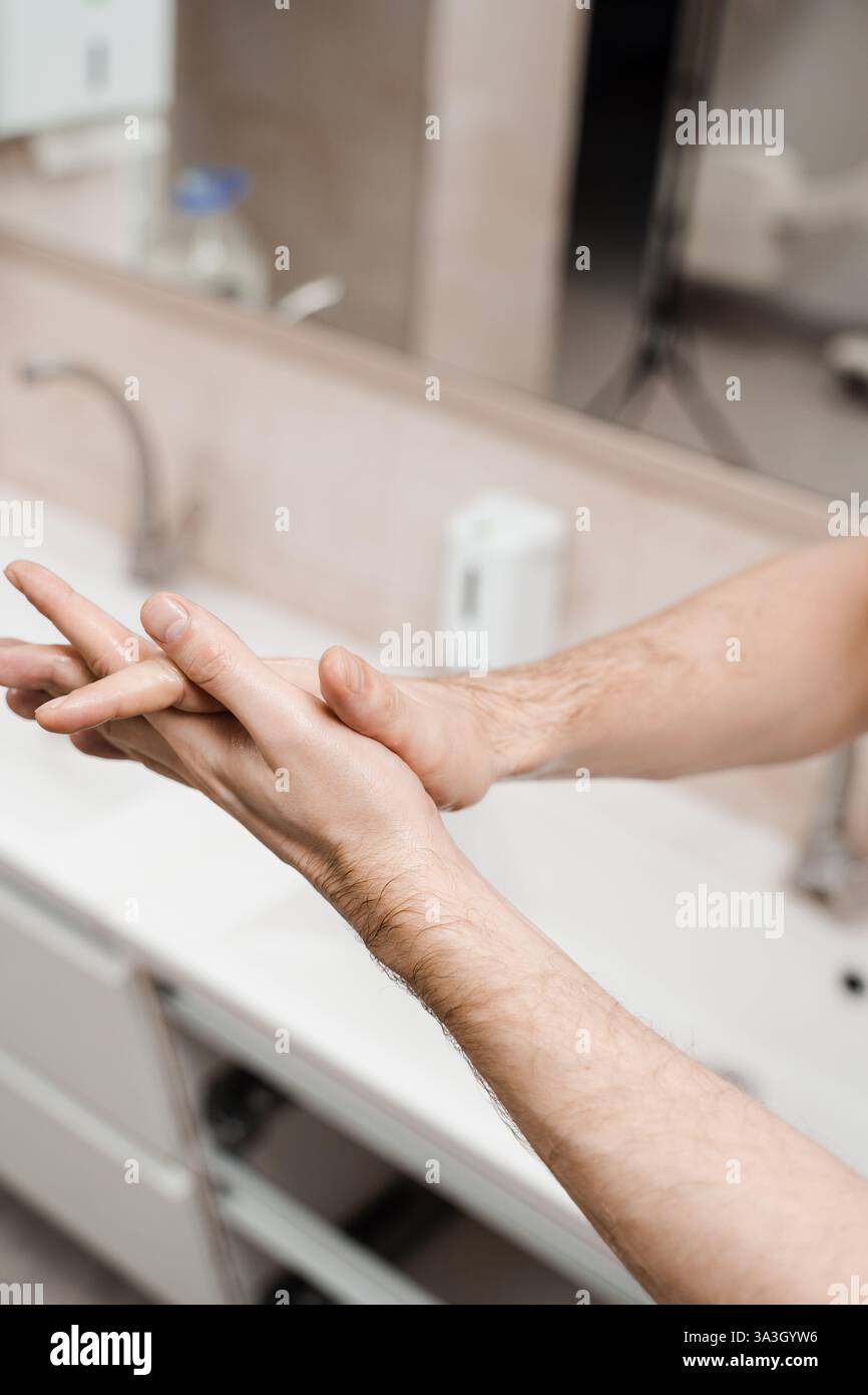 Doctor surgeon is washing hands before surgery in medical clinic ...