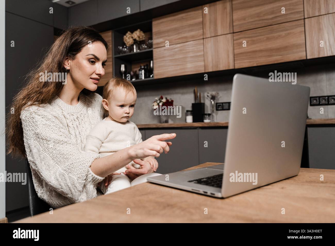 Mom and child daughter communicate with dad via video communication on ...