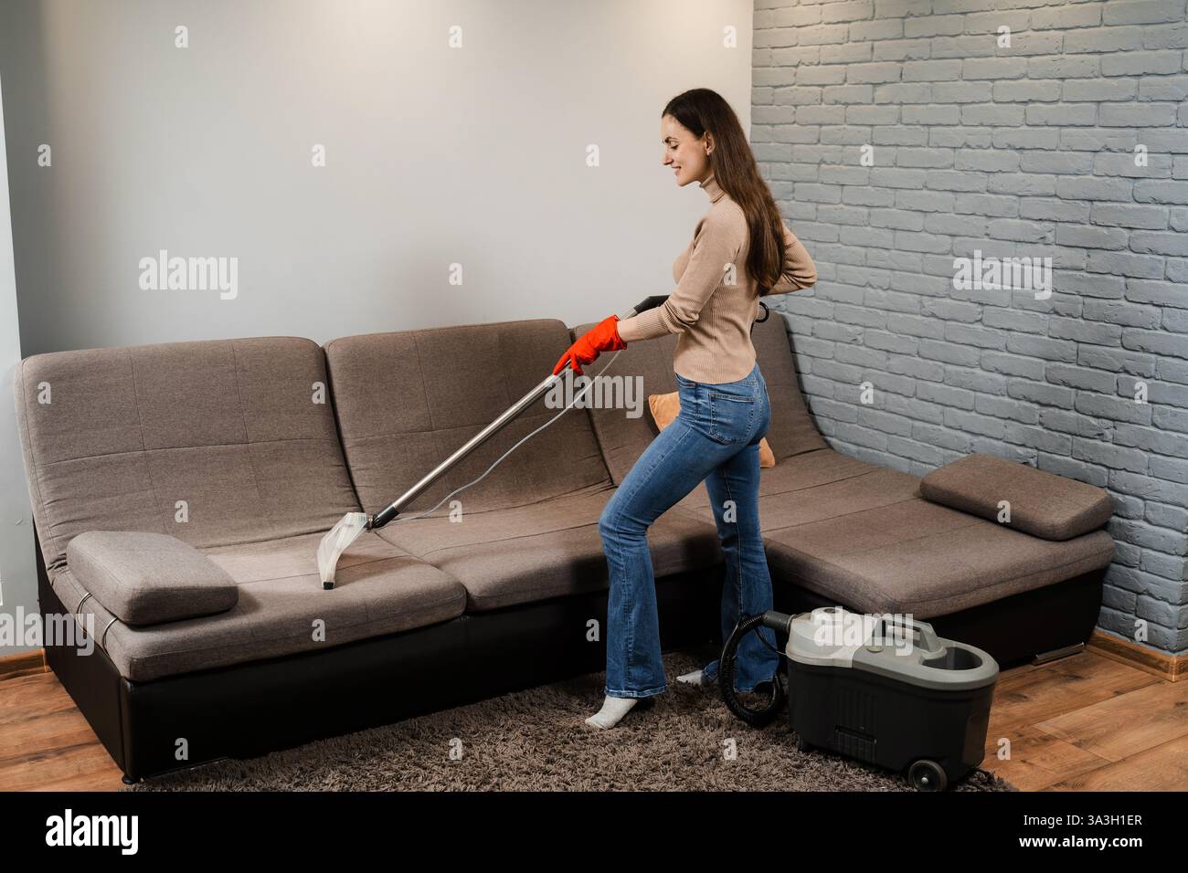 Dry cleaning extractor mop machine is spraying water and detergent on ...