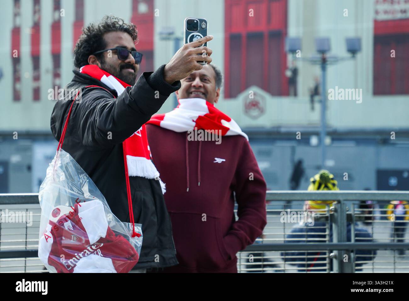 Fans arrive at Emirates Stadium prior to the Premier League match ...