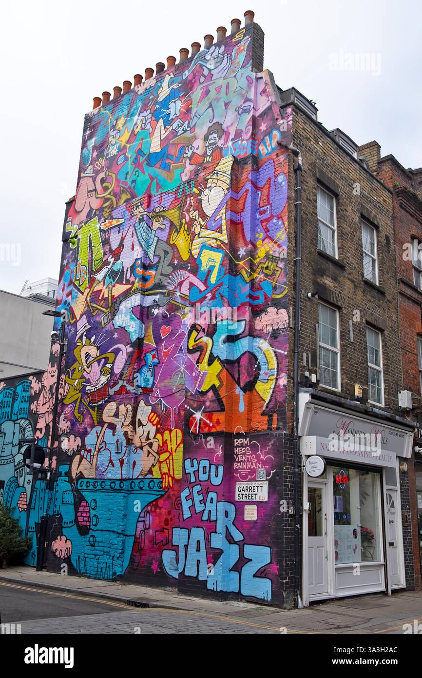'You Fear Jazz' wall mural graffiti painting on end of terraced housing shops corner of Garrett ...