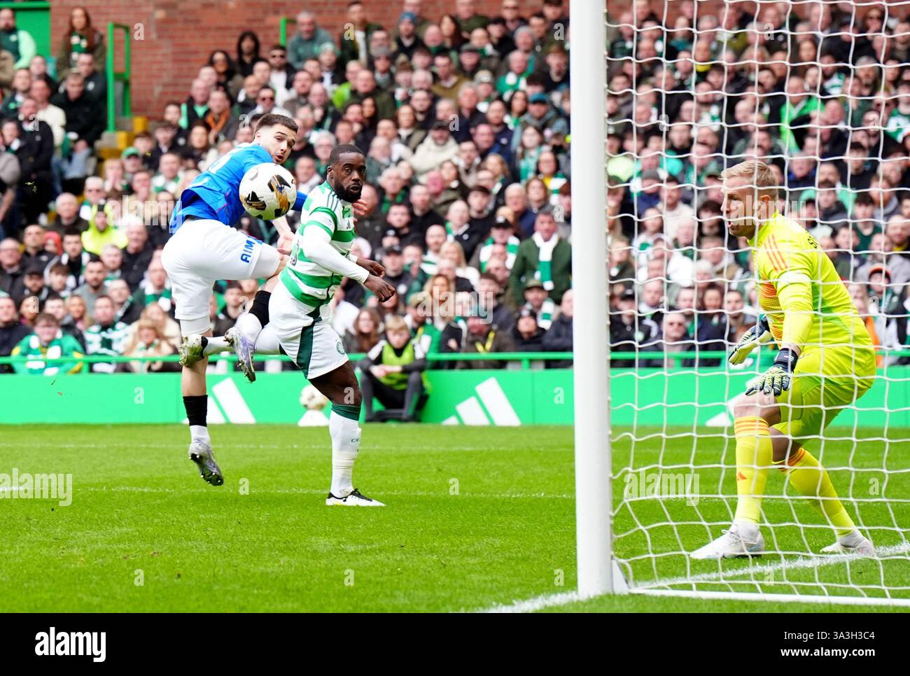Rangers' Nicolas Raskin (left) scores his sides first goal during the ...
