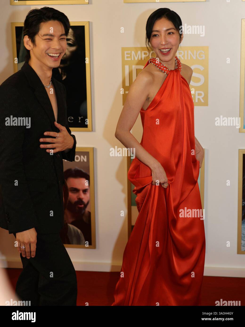 Cheryl Yang, right and Austin Lin arrive for the 18th Asian Film Awards ...