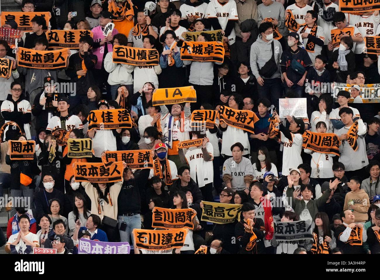 Yomiuri Giants fans sing and cheer in the seventh inning of an MLB ...