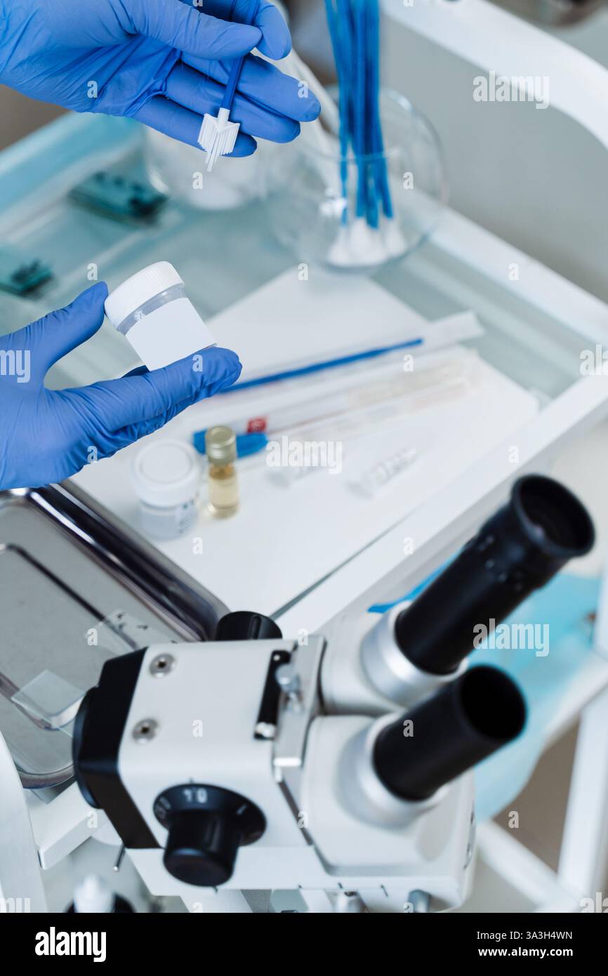 Gynecological cytology Pap smear test and cytobrush in hands of ...