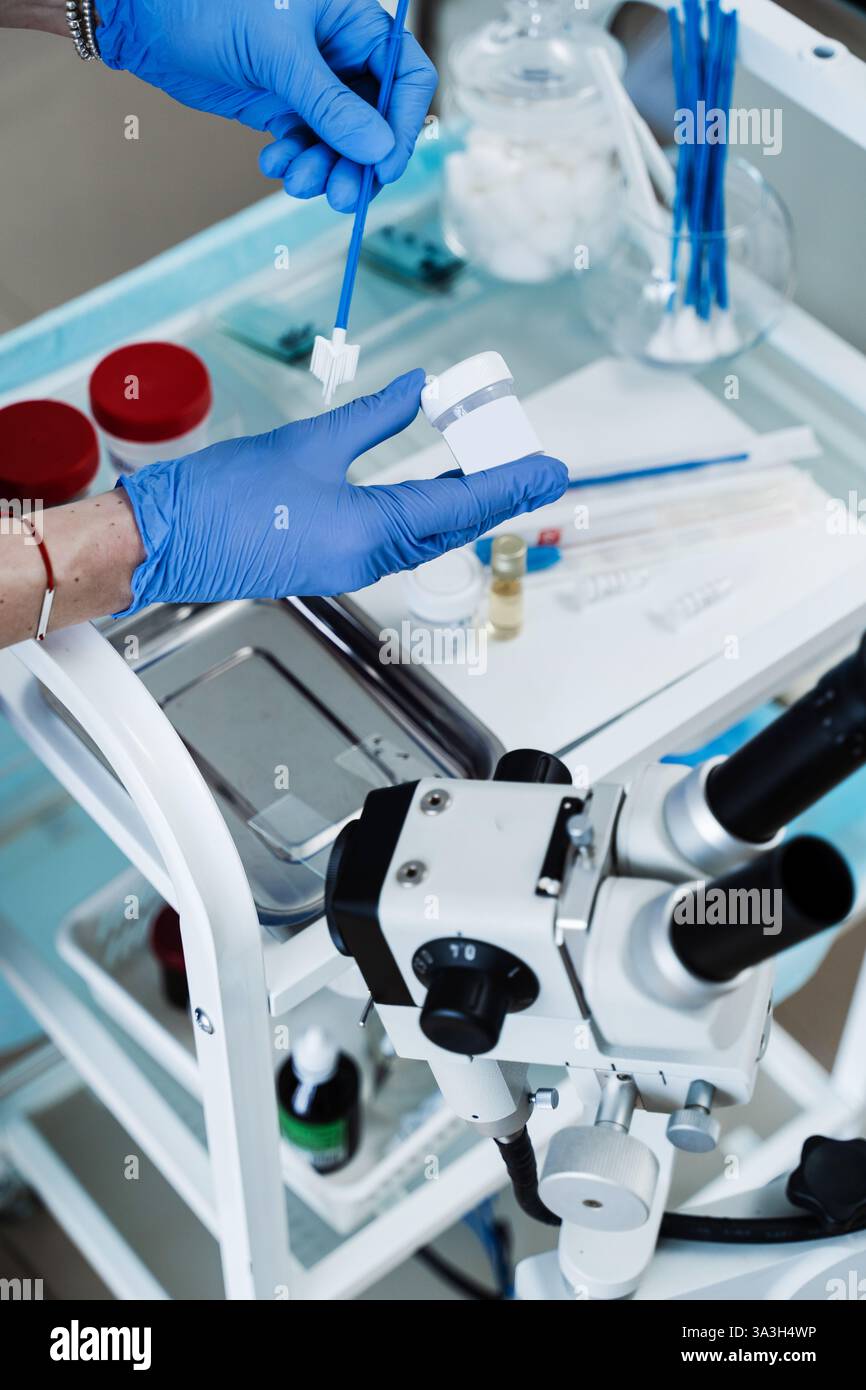 Gynecological cytology Pap smear test and cytobrush in hands of ...