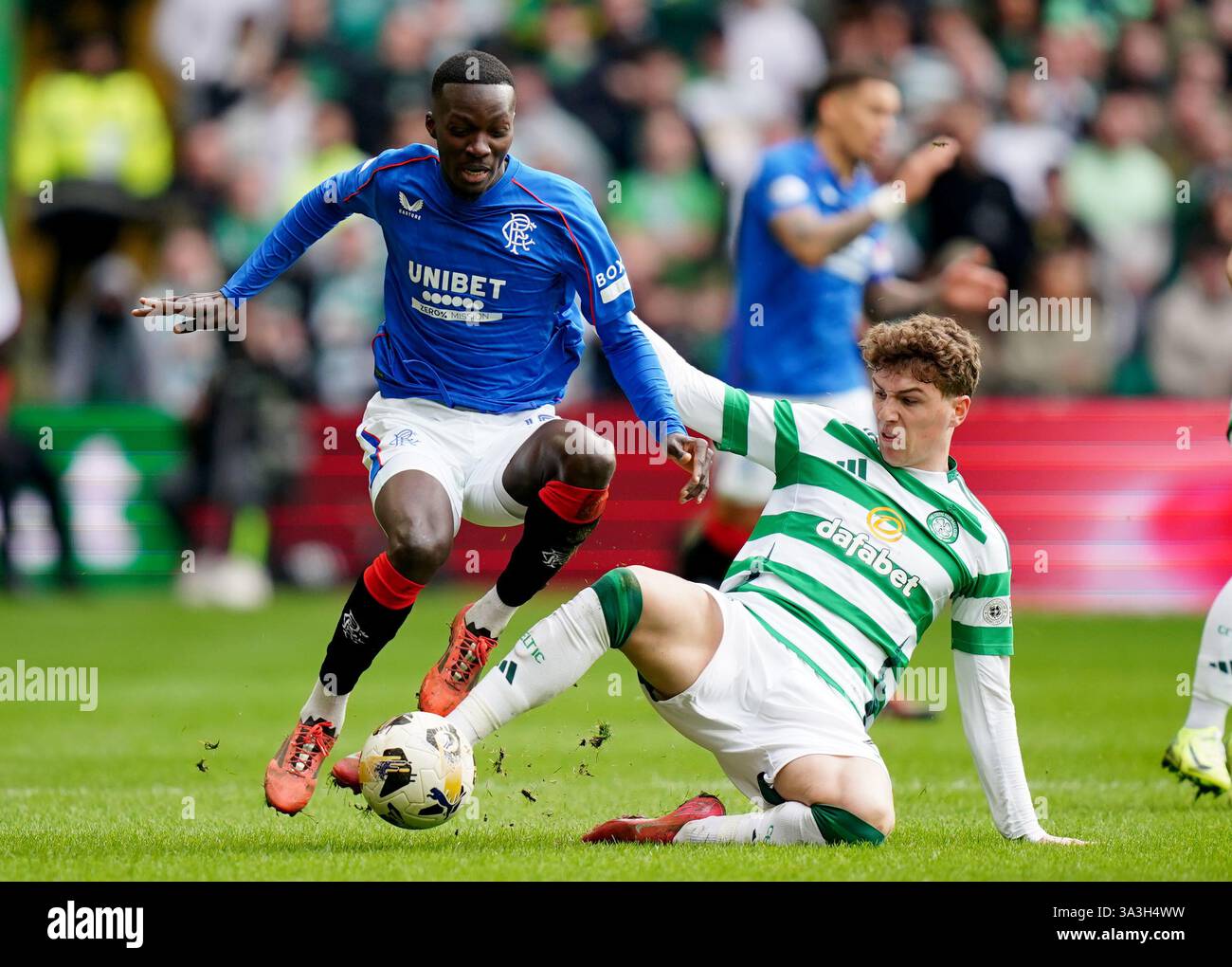 Rangers' Mohamed Diomande (left) and Celtic's Arne Engels battle for ...
