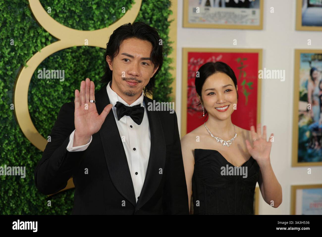 Louis Cheung, left and Kay Tse arrive for the 18th Asian Film Awards ceremony, at the Xiqu ...