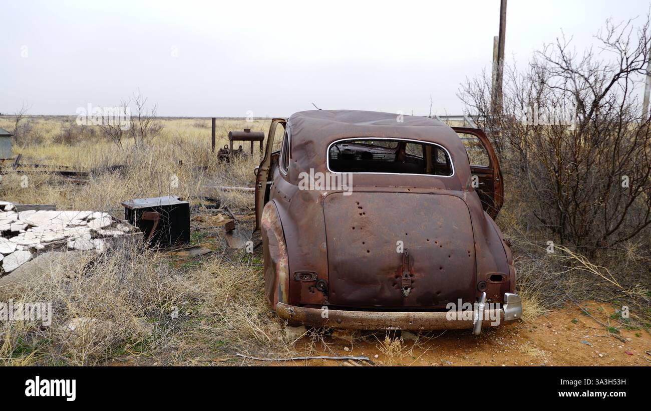An abandoned car, riddled with bullet holes Stock Photo - Alamy