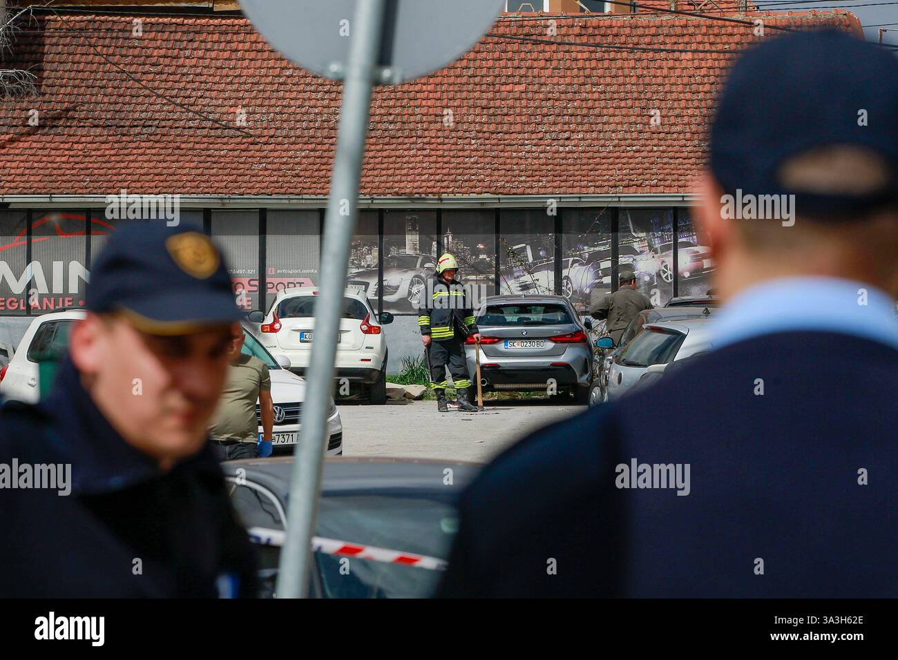 Police officers block a road near a nightclub in the town of Kocani ...
