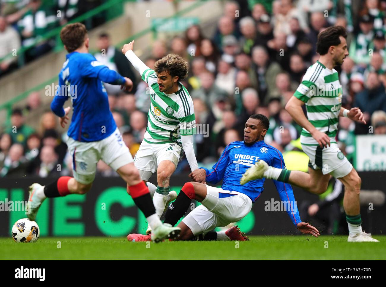 Rangers' Dujon Sterling fouls Celtic's Jota during the William Hill ...