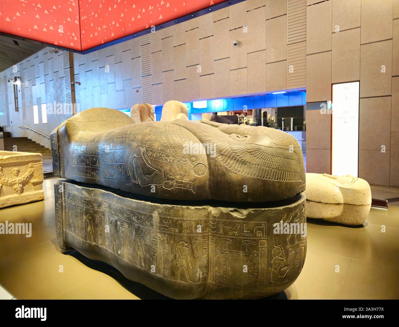 Giza, Egypt, February 22 2025: Ancient coffin in The Grand Egyptian Museum Giza GEM gallery, an ...