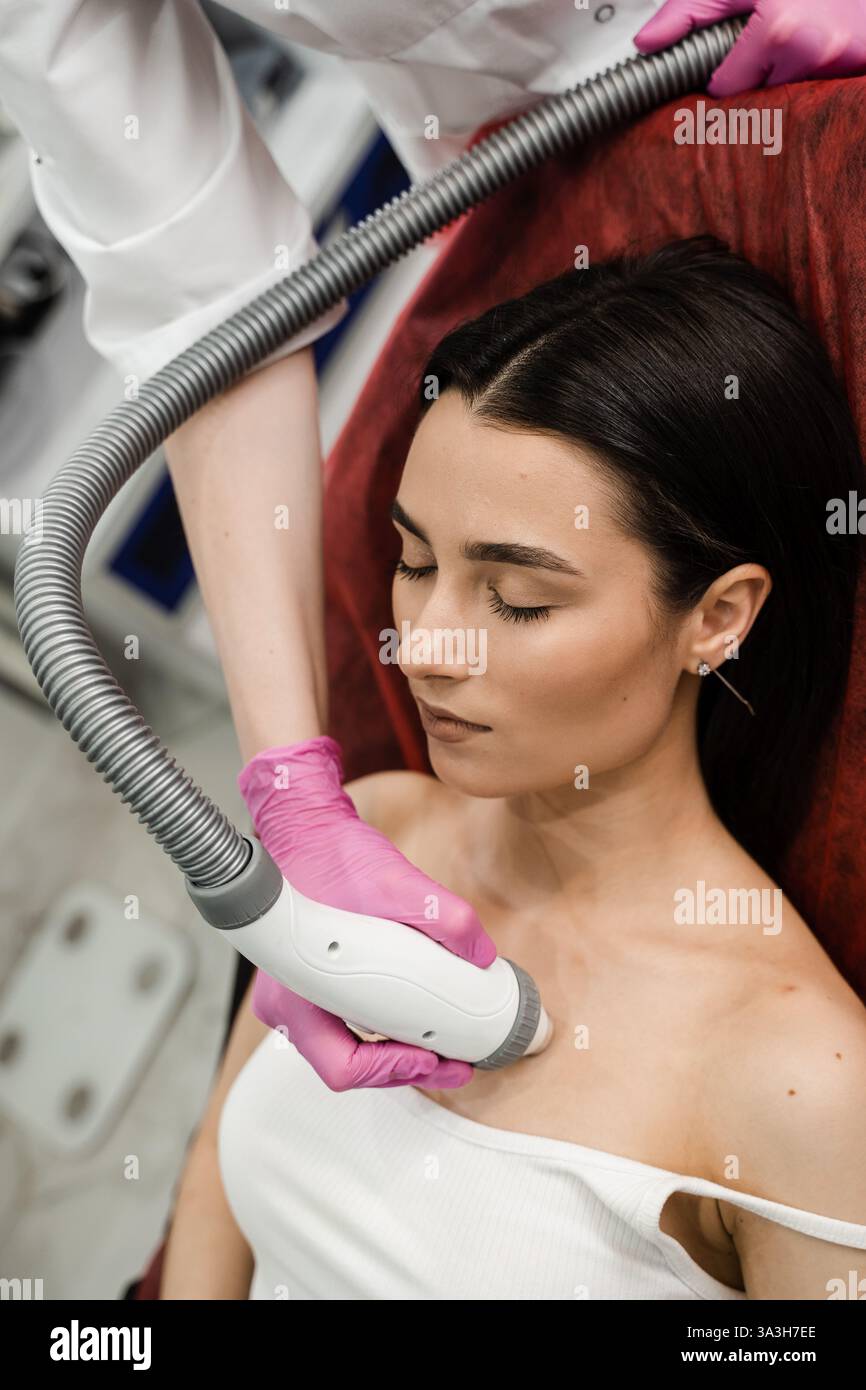Tightening and rejuvenation of facial skin of girl at cosmetology ...
