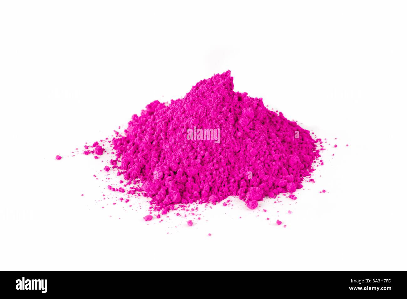 A vibrant magenta powder sits in a pile beside a gardening tool on a ...