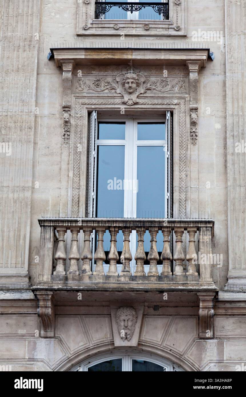 A detailed view of a balcony with sculpted embellishments at a historic ...