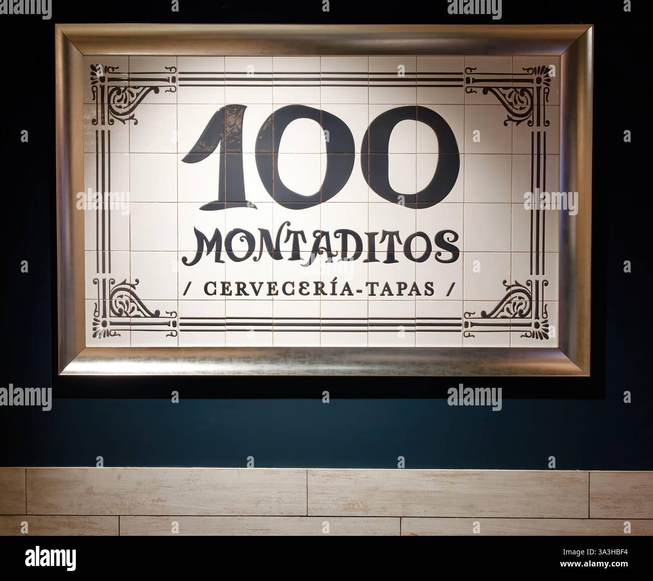 Sign for Spanish fast food chain 100 Montaditos in shopping centre El ...