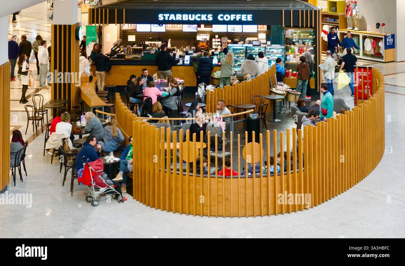 Busy Starbucks Coffee branch with an indoor terrace inside shopping ...