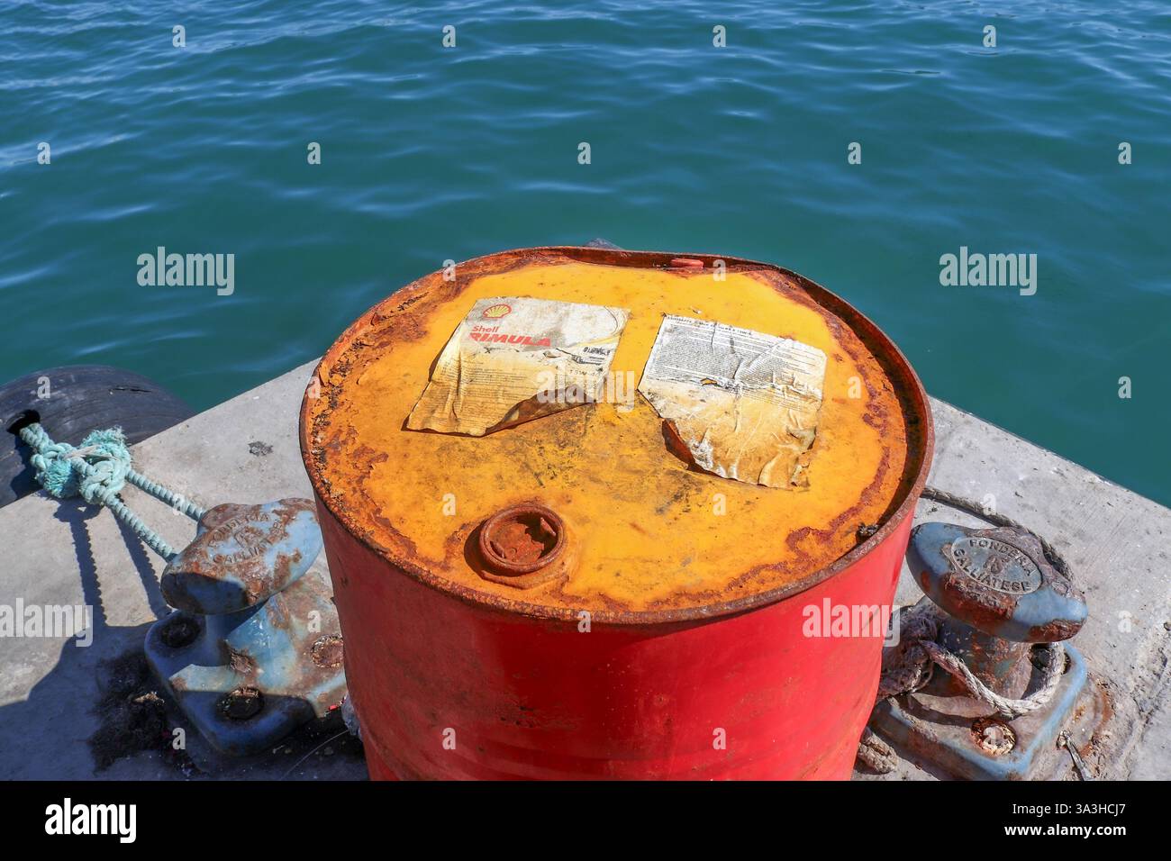 Valletta, Malta 27. September 2024, Rusty red and yellow oil barrel ...