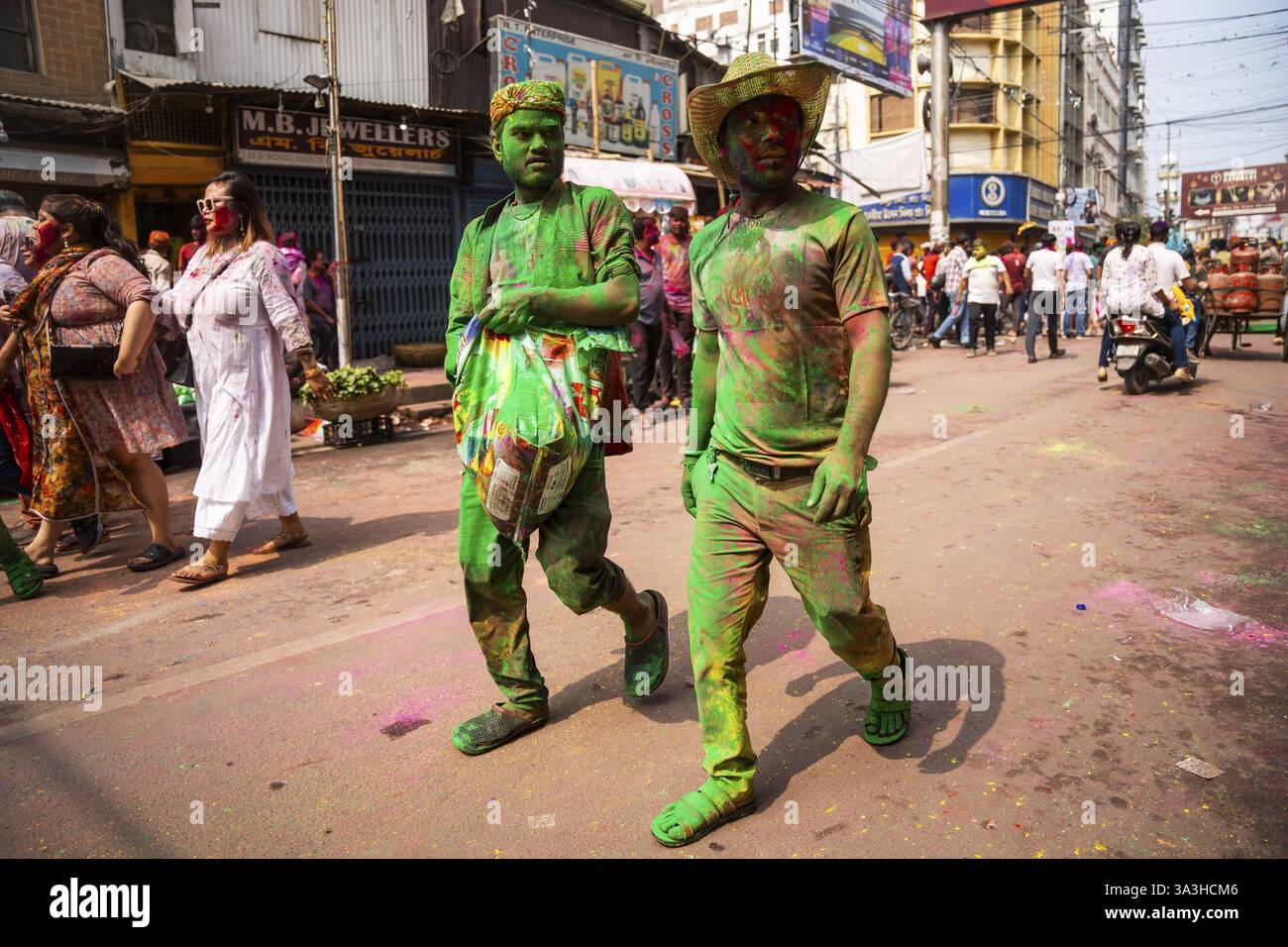 Revellers smear with Gulal or coloured powder and dance to play Holi ...
