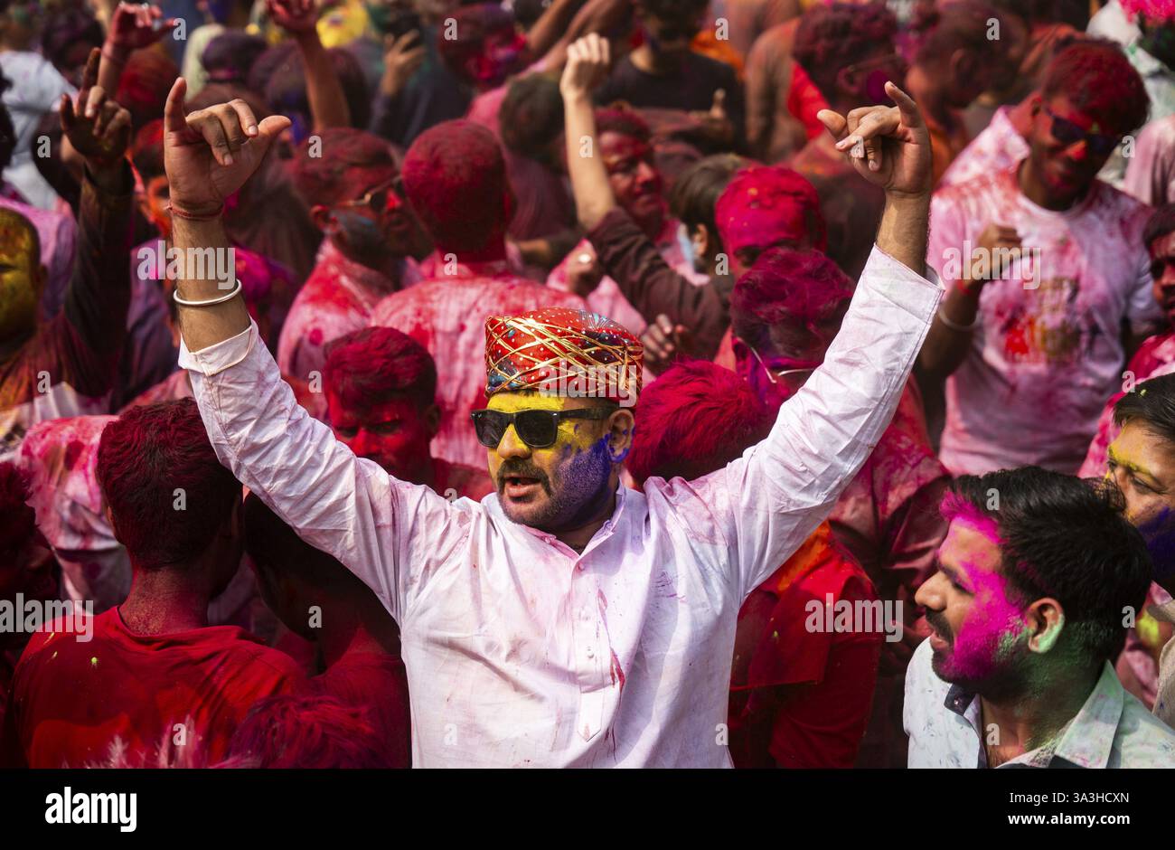 Revellers smear with Gulal or coloured powder and dance to play Holi ...