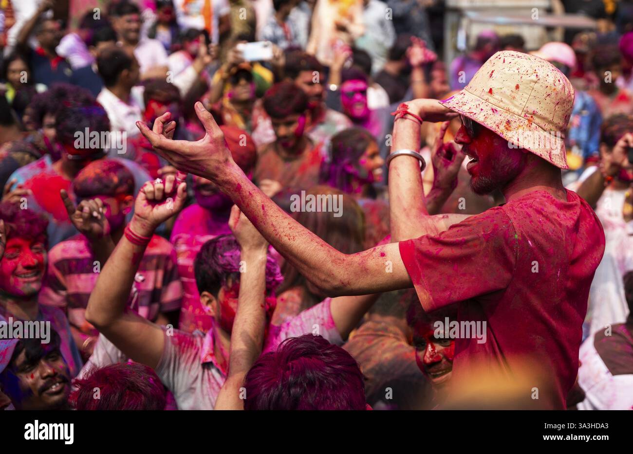 Revellers smear with Gulal or coloured powder and dance to play Holi ...