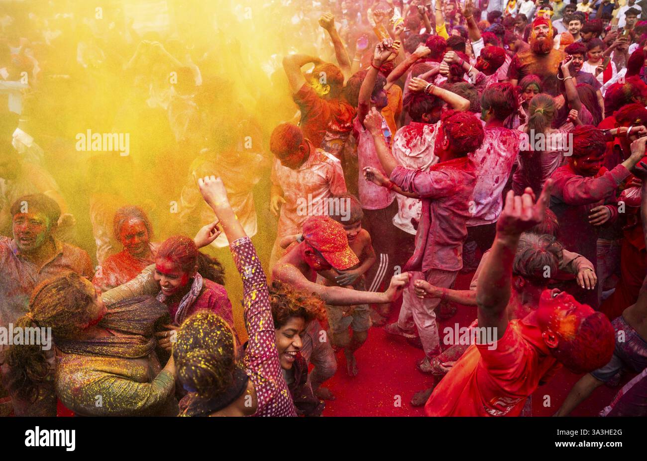 Revellers smear with Gulal or coloured powder and dance to play Holi ...