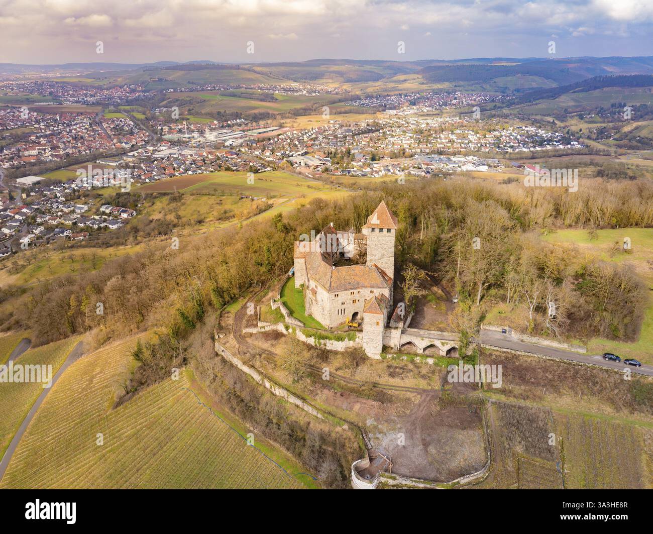 Historic castle on a hill with panoramic views over a town and fields ...